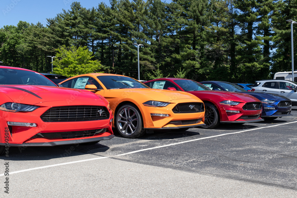 Ford Mustang display at a dealership. Ford offers the Mustang in a base ...