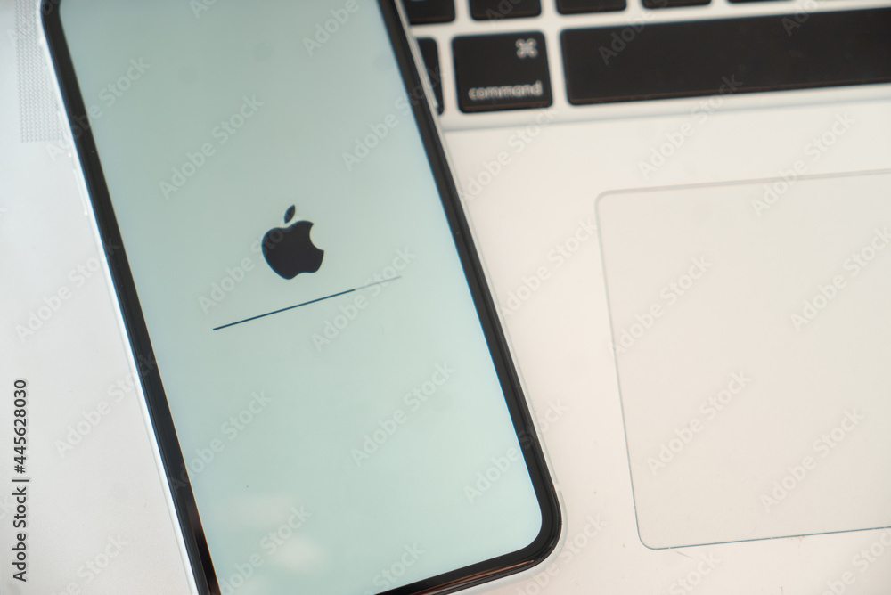 Closeup of screen displaying apple logo and nearly complete progress ...