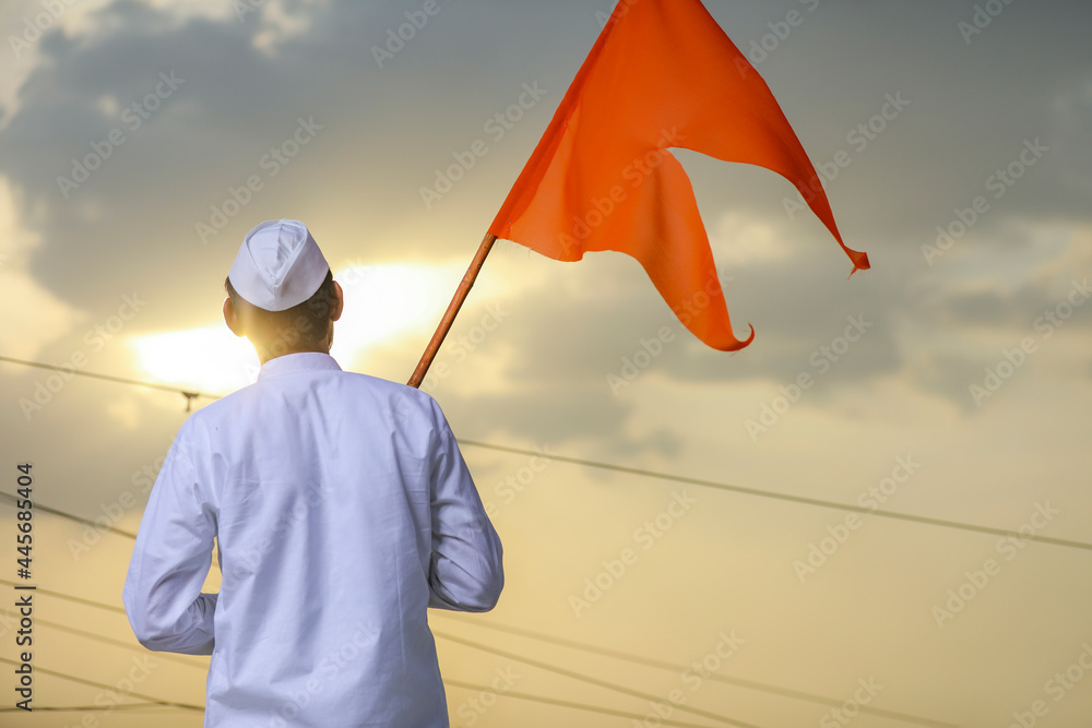 Young indian man (pilgrim) in traditional wear and waving religious ...
