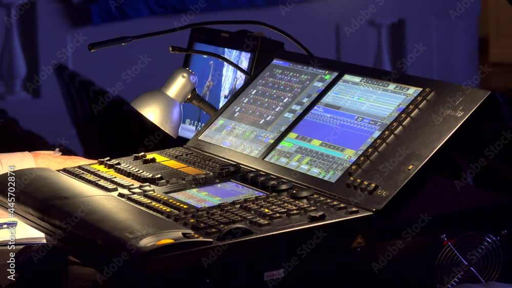 Work of the lighting engineer behind a lighting console. Stock Video ...