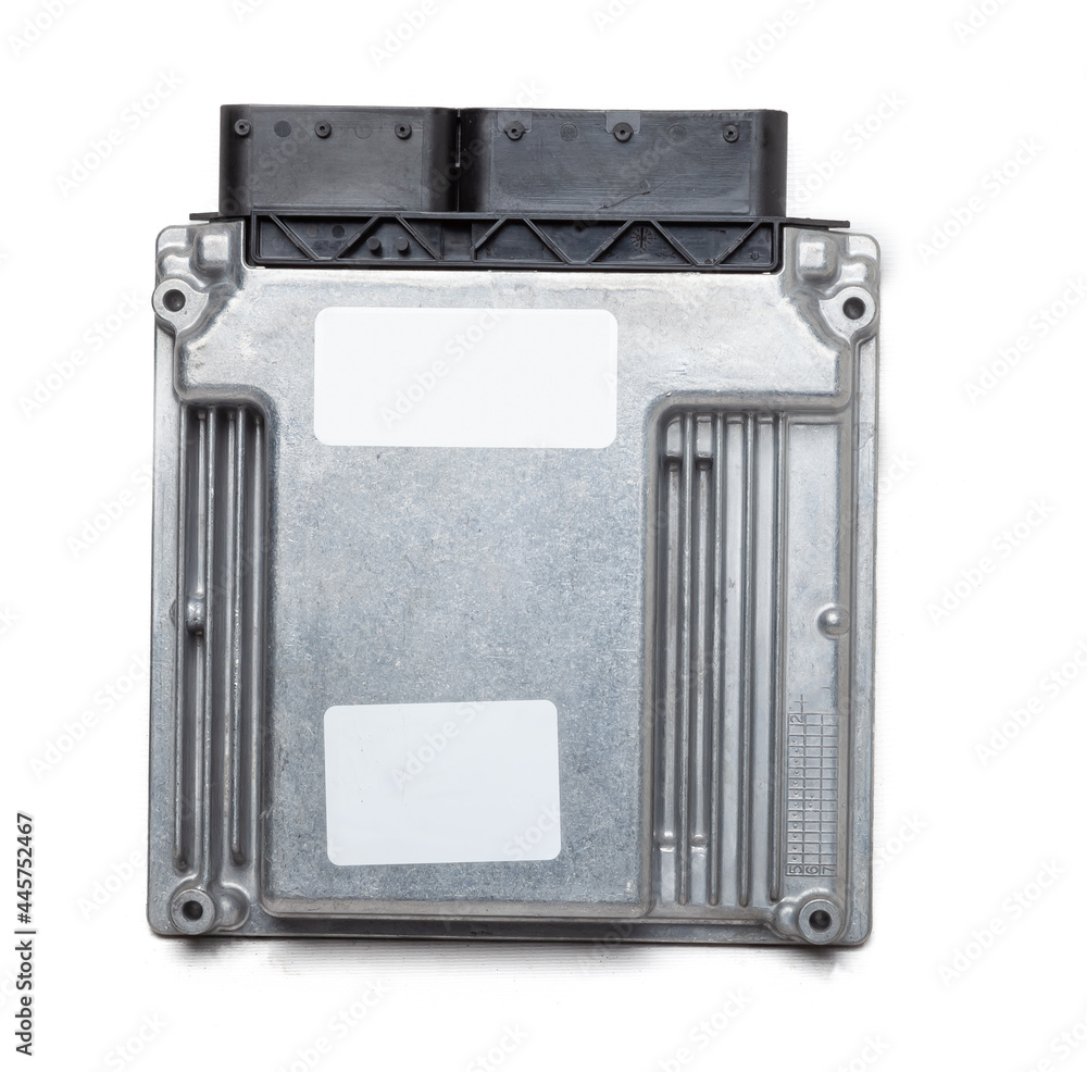 Metallic car engine control unit with plastic elements on a white ...