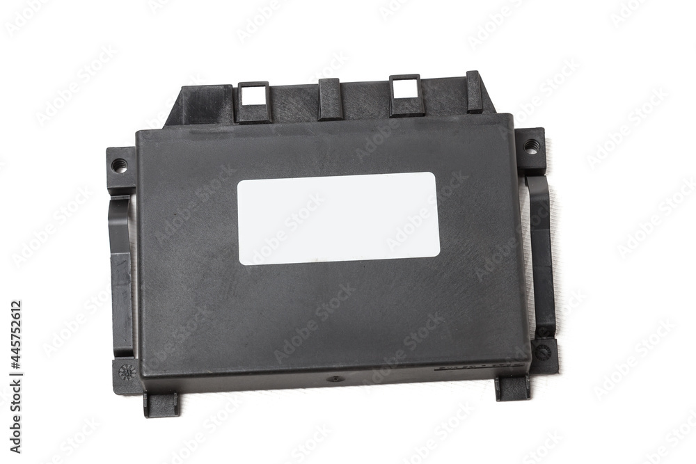 Plastic car engine control unit with metal elements on a white isolated ...