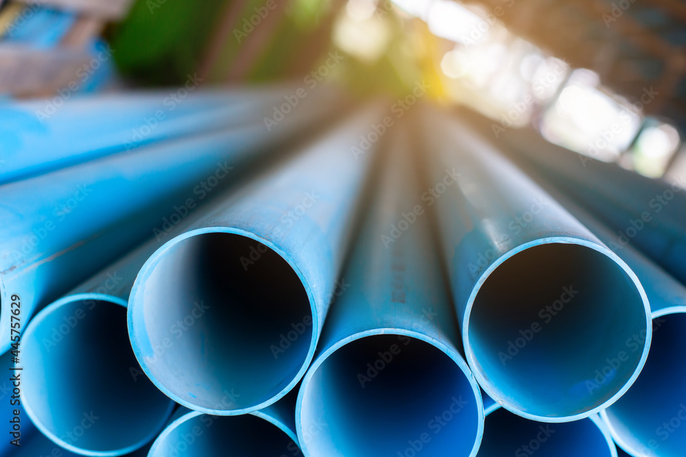Close up to blue plastic pipe background, PVC pipes stacked in ...