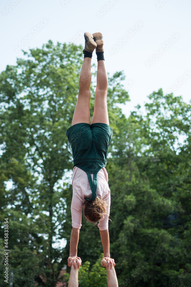 Portrait on back view of girl balancing during the street scene ...