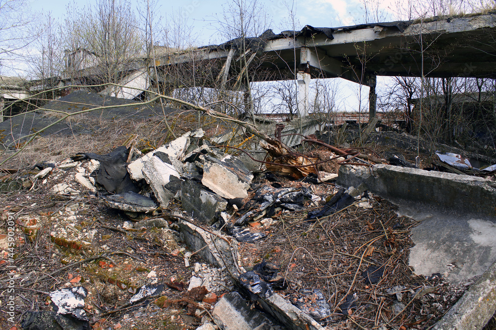 Destroyed abandoned building ruins. Farm hangar destroyed by weather ...