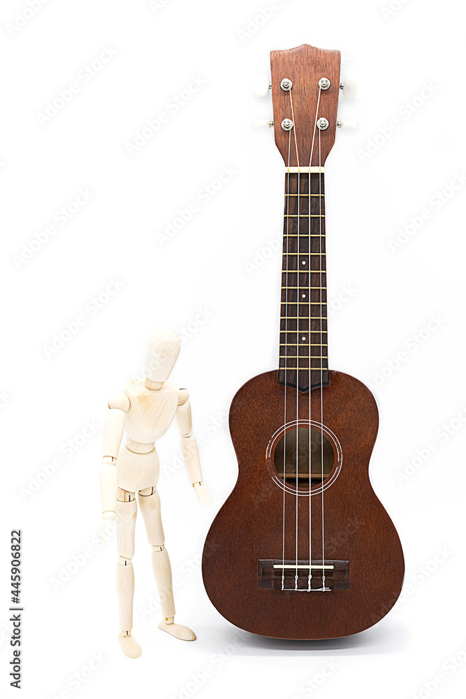 Ukulele acoustic guitar with human mannequin figure . Break time for ...