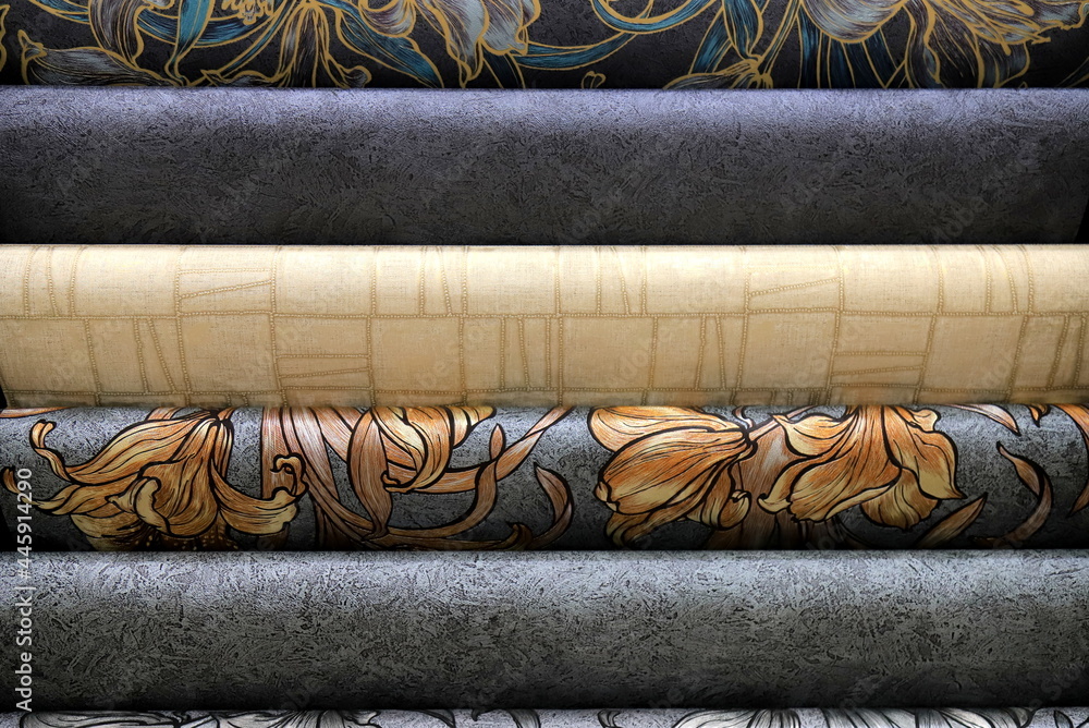 Rolls of vinyl wallpaper. Various textures and colors of paper for wall ...
