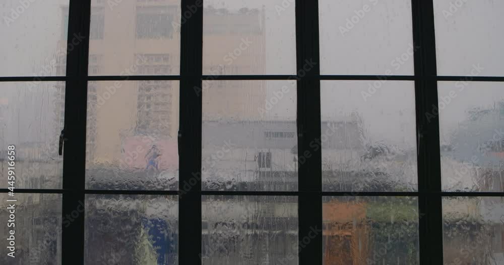 The interior of cute city apartment with large panoramic windows in the ...