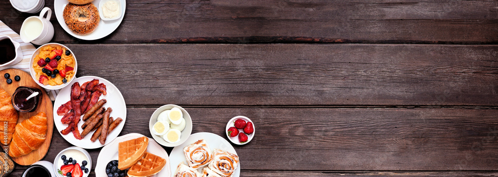 Breakfast or brunch corner border on a dark wood banner background ...