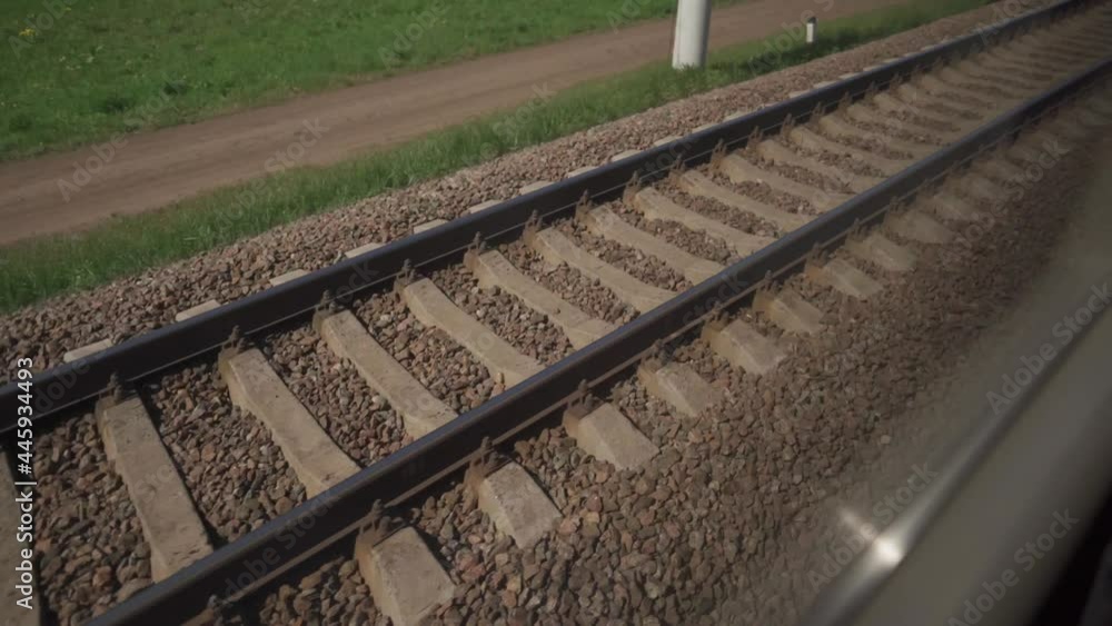 View on railroad track from the window of train. Bullet train rides on ...