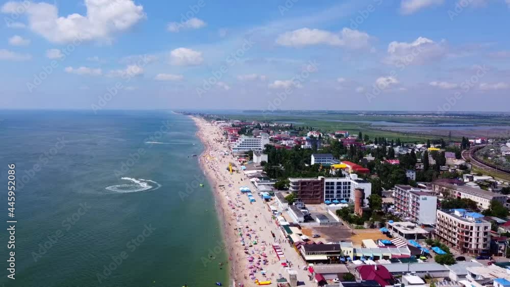 Sea and sand beach in Zatoka. Hotels and houses. Vacationers on the ...