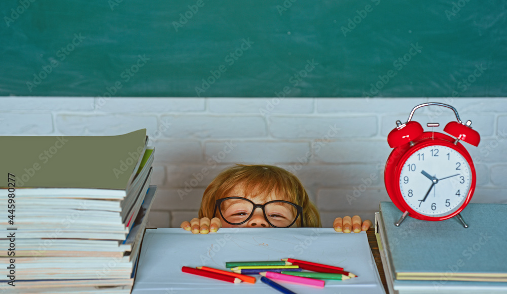 Time to learn concept. School kids against green chalkboard. Learning ...