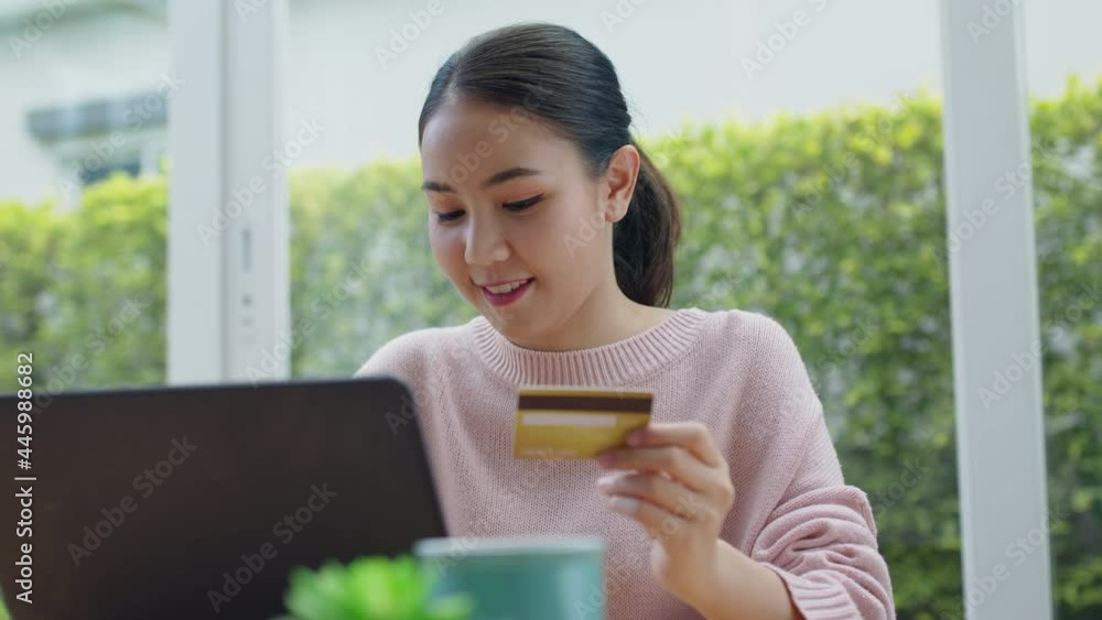 Young asia people sit relax smile enjoy gift card typing secure code ...