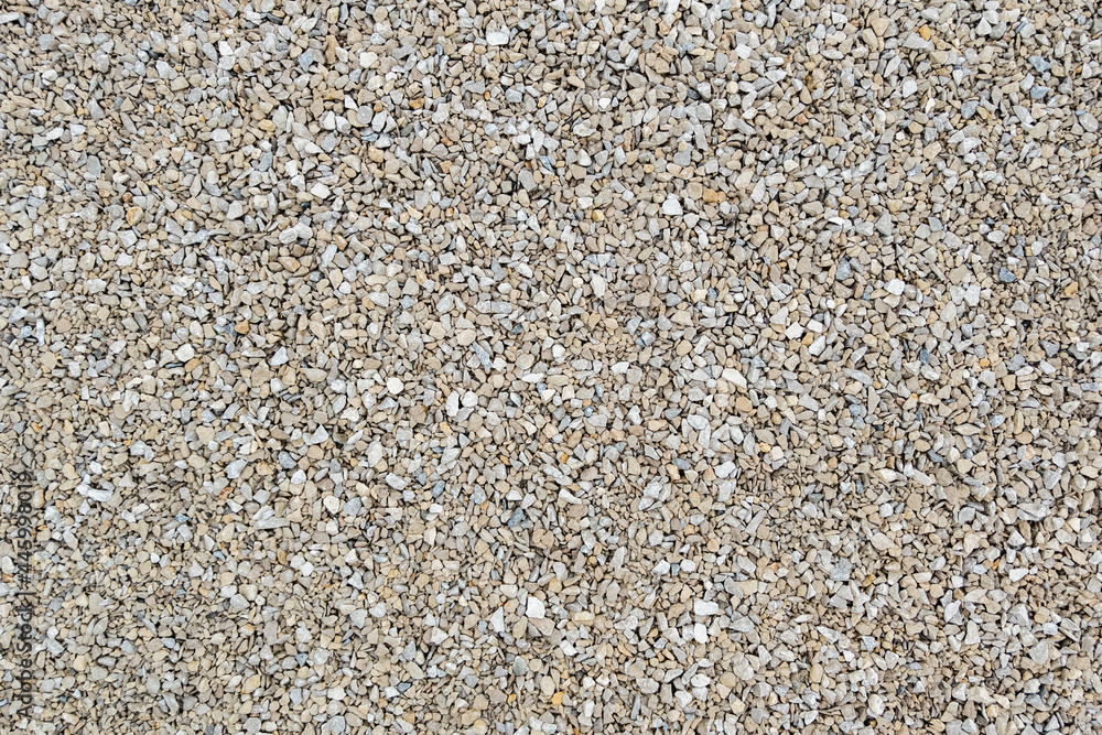Dry white limestone ballast flat full frame background. Small gray ...