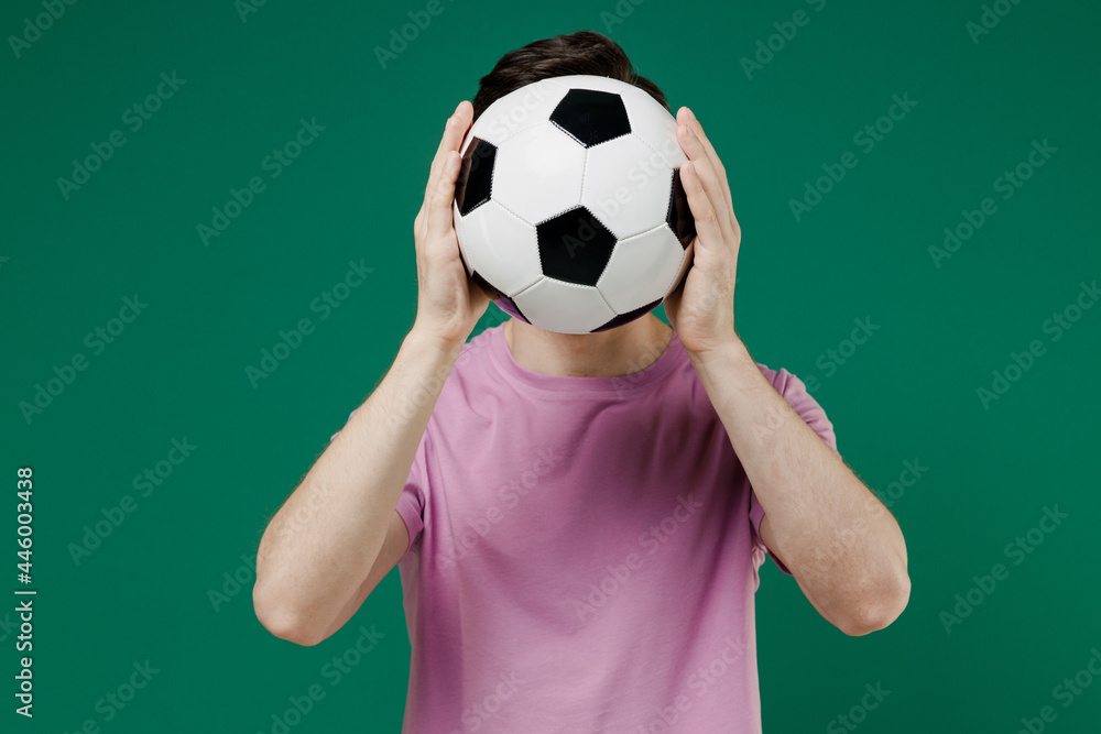 Young european man fan supporter wears basic pink t-shirt cheer up ...