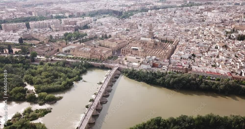 Scenic aerial view of ancient Roman bridge across Guadalquivir river ...