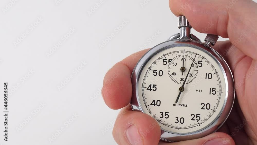 Mechanical Stopwatch in man's hand. Male hand holding stopwatch on ...