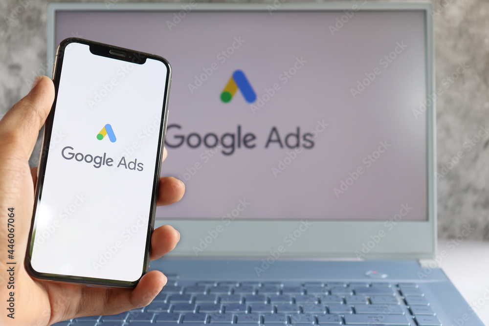 Google Ads logo on computer screen and Google Ads logo on mobile phone ...