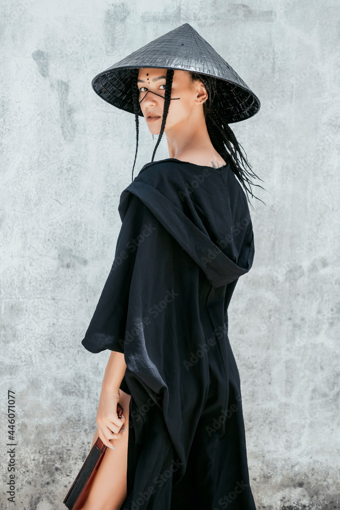 Beauty samurai woman posing in the street, black color style, fashion ...