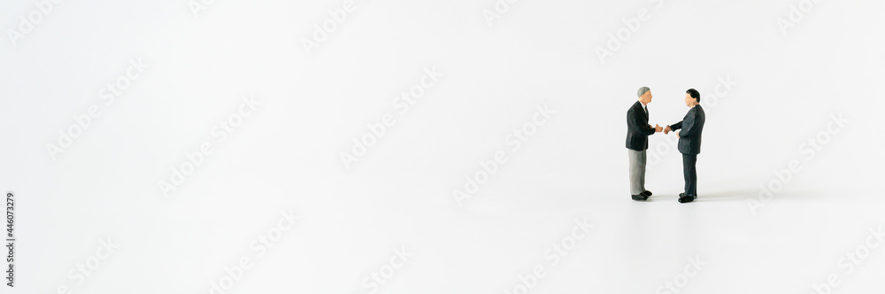 Miniature businessman handshake partner client customers with success ...