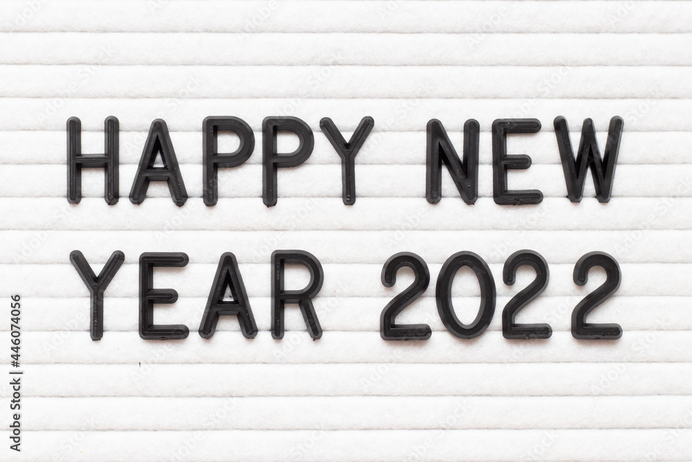 Black color letter in word happy new year 2022 on white felt board ...