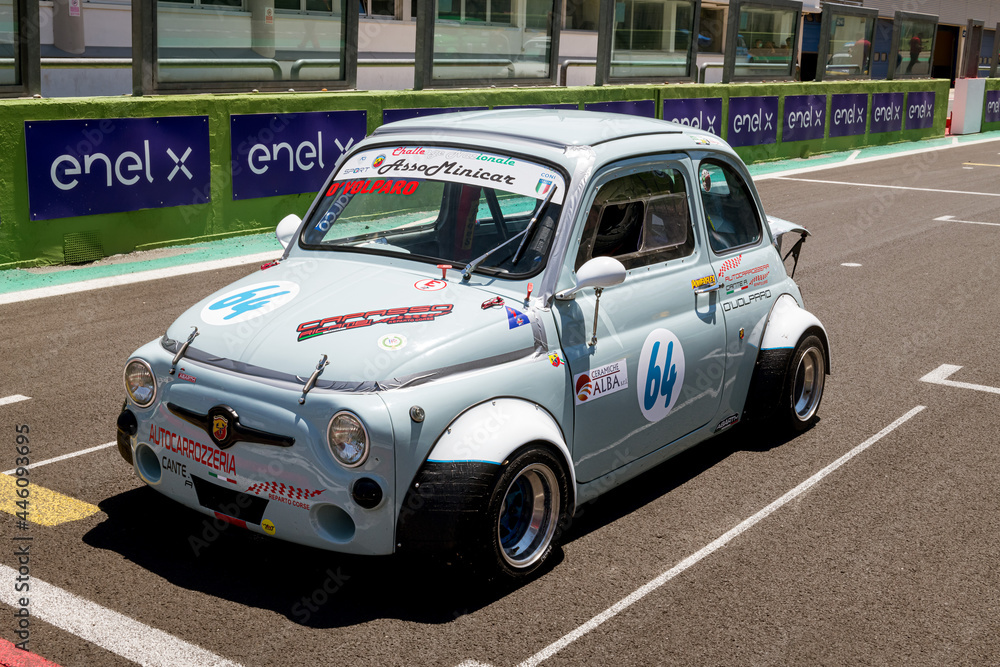 Fiat 500 old classic italian mini car racing on asphalt track standing ...
