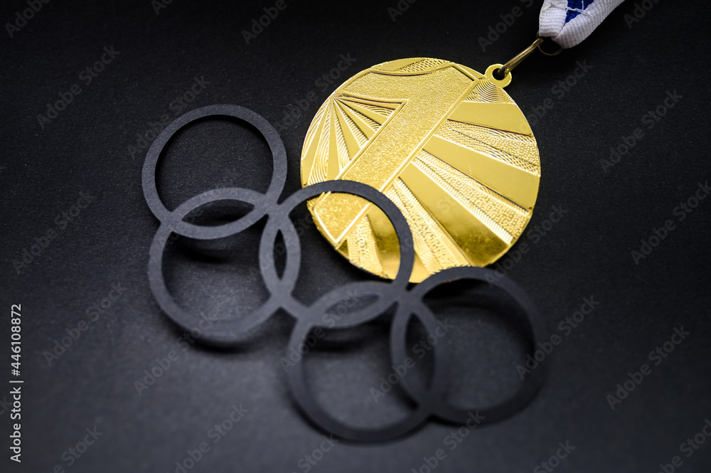 TOKYO, JAPAN, JULY. 19. 2021: Gold medal and olympic logo. Winner of ...