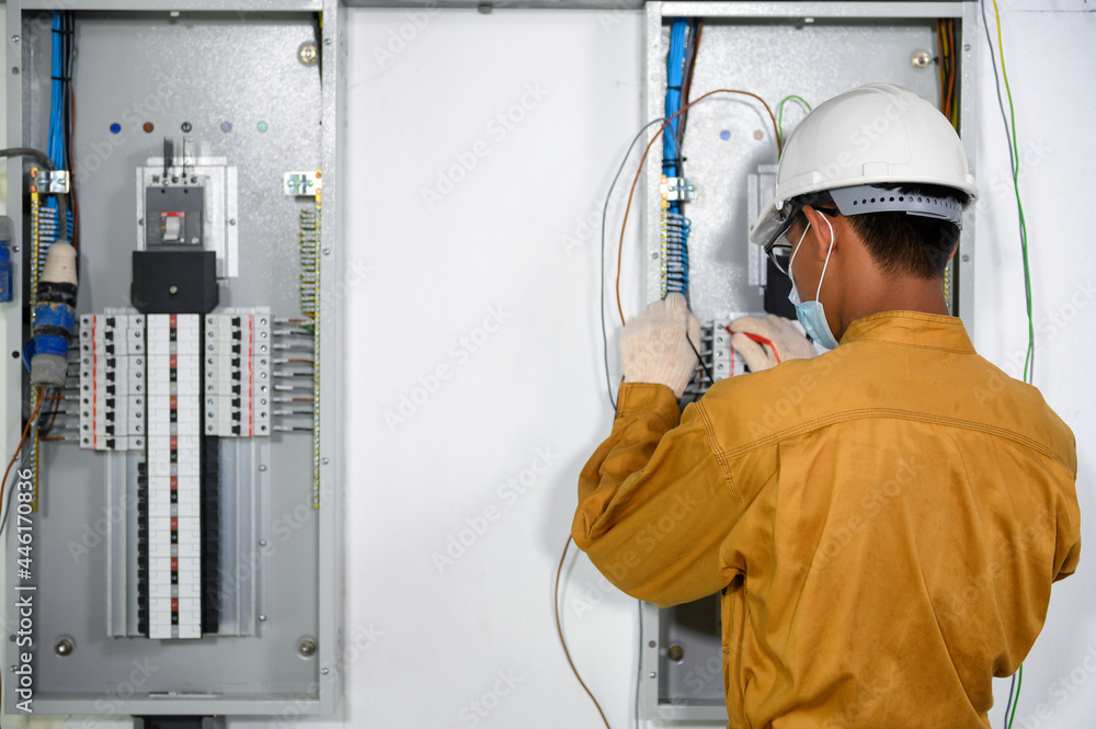 Electrician engineer using digital multimeter test current electric in ...