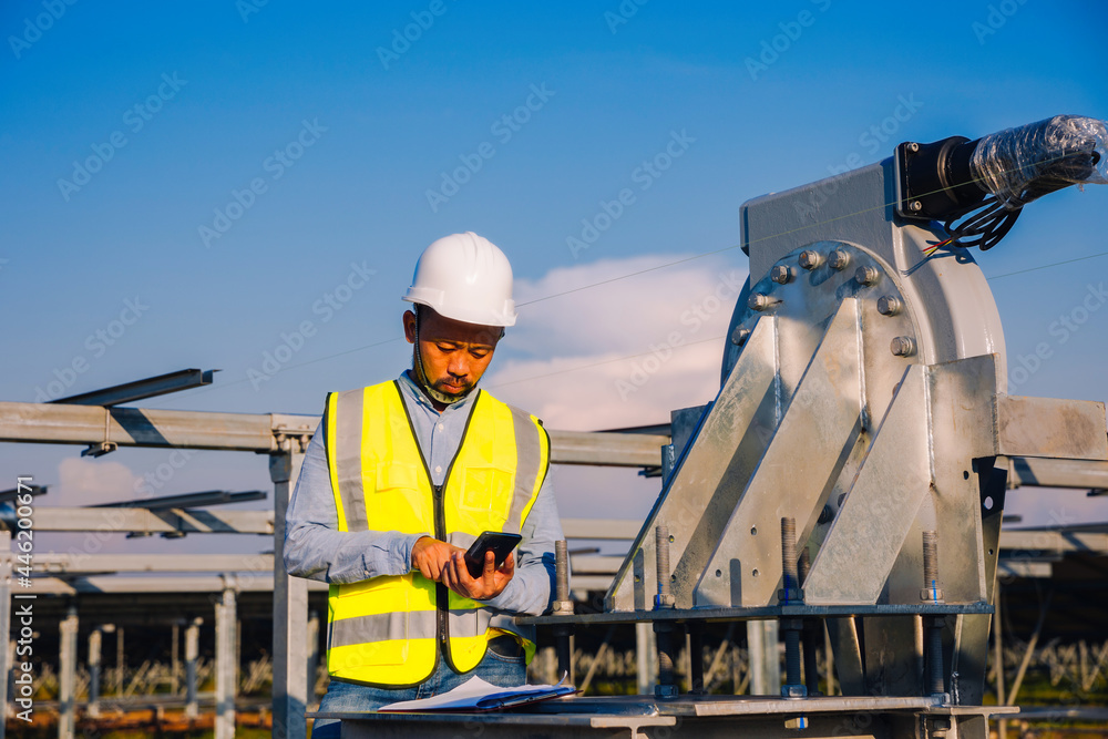engineer inspect solar tracking machine in solar power plant; Monitor ...