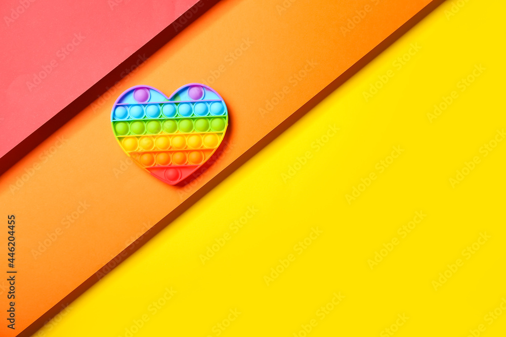 Pop it fidget toy on color background Stock Photo | Adobe Stock