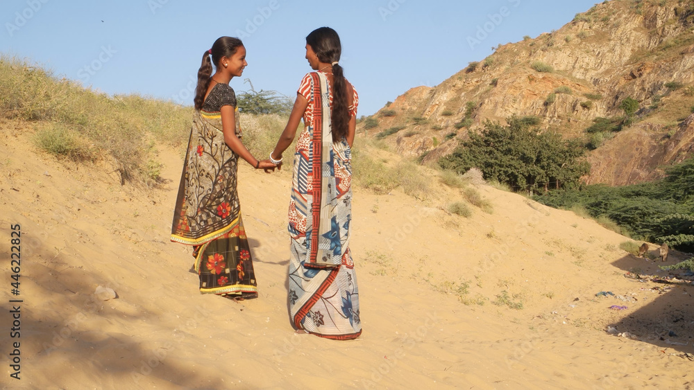 Happy Indian girls in traditional clothes holding hands outdoor Stock ...