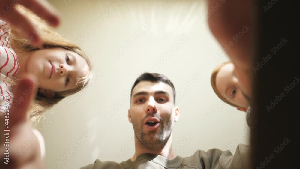 Happy father and his little children opening carton package and pulling ...