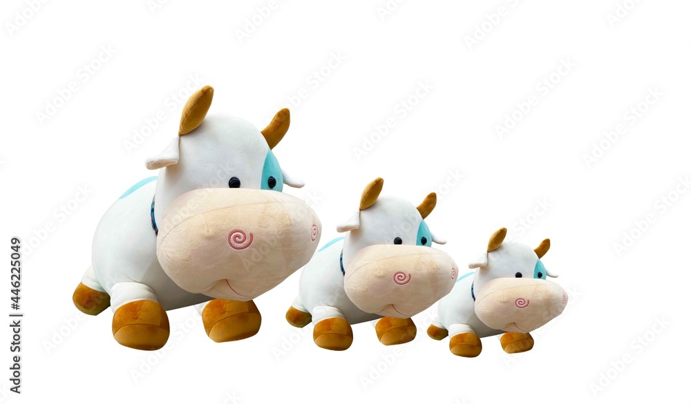 cheerful family of soft toy cows against white background ,The funny ...