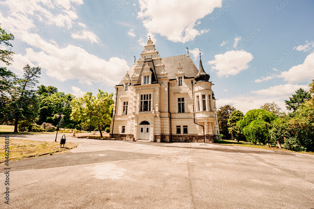 Budmerice Castle from 19th century in nature landscape. Tree in forest ...