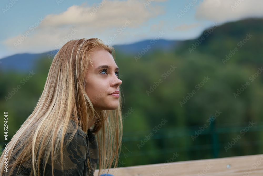 Woman Looking Up At Sky Profile