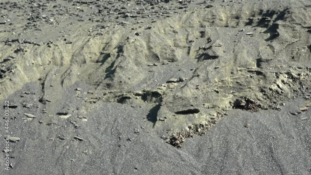 Close-up of slag from metallurgical furnaces during the day. Waste from ...