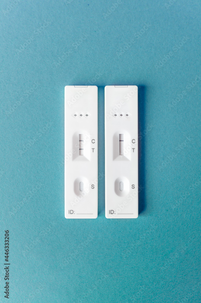 Positive and negative rapid lateral flow COVID 19 tests Stock Photo ...