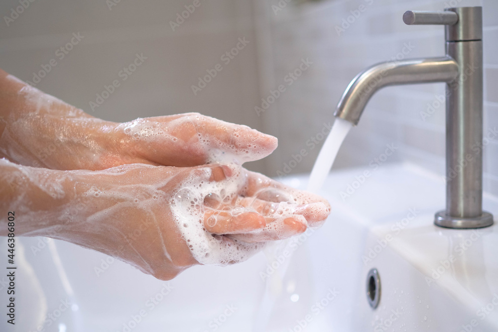 Personal hands wash with soap bubbles and rinse with clean water. Good ...