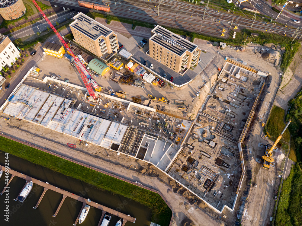 Luxury apartment complex construction site at riverbank of river IJssel ...