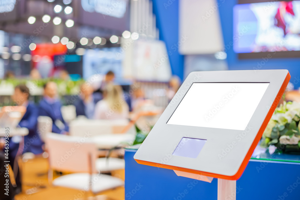 Electronic multimedia tablet kiosk with blank white display against ...