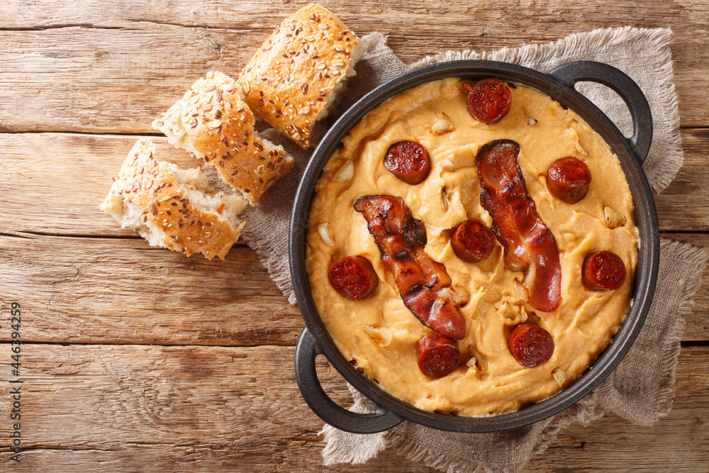 Spanish food Gachas of pea flour with paprika served with bacon and ...