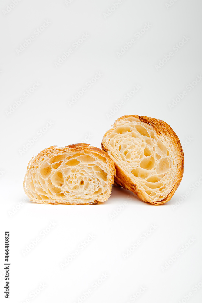 Delicious traditional Fresh croissant cut in half Stock Photo | Adobe Stock