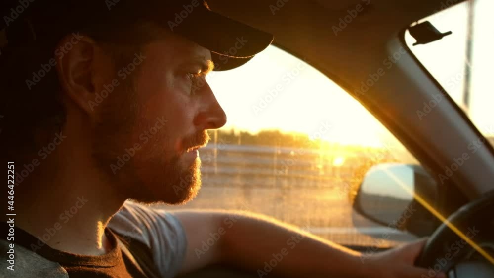 Man Driving a Car at Sunset. Male Hand on steering wheel close up ...