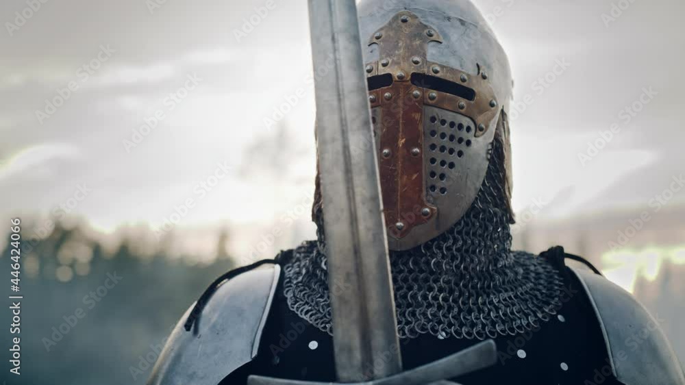 Medieval Knight Wearing Armour and Helmet, Draws Sword from Shearh ...