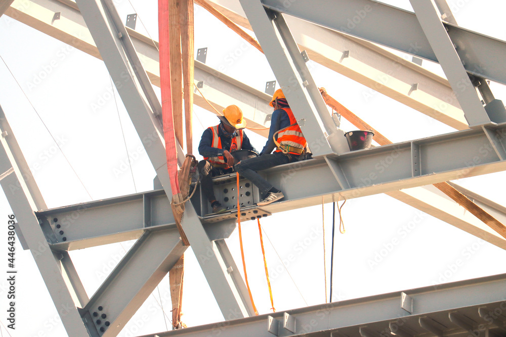 Working at Heights Safely, Workers building a train station at Thailand ...