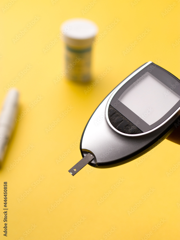 Blood glucose meter, the blood sugar value is measured on a finger on ...