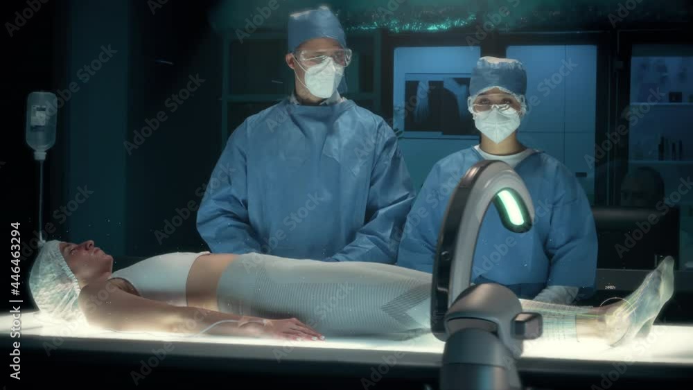Team of surgeons perform a delicate operation using modern medical full ...