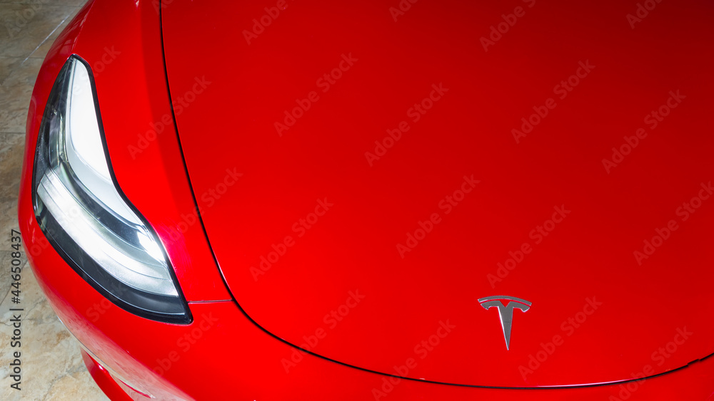 New Tesla model 3 electric vehicle logo and hood close up. Tesla icon ...