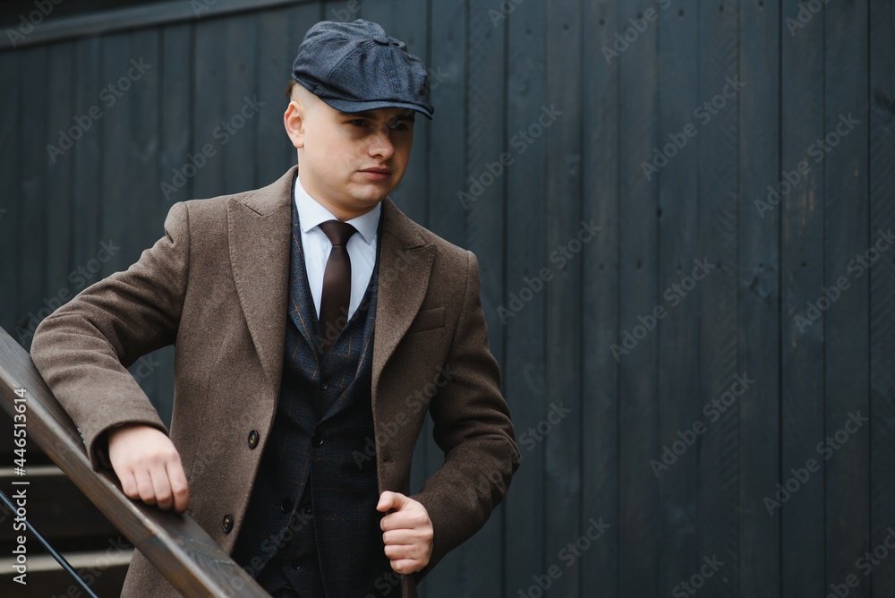 A man posing in the image of an English retro gangster of the 1920s ...