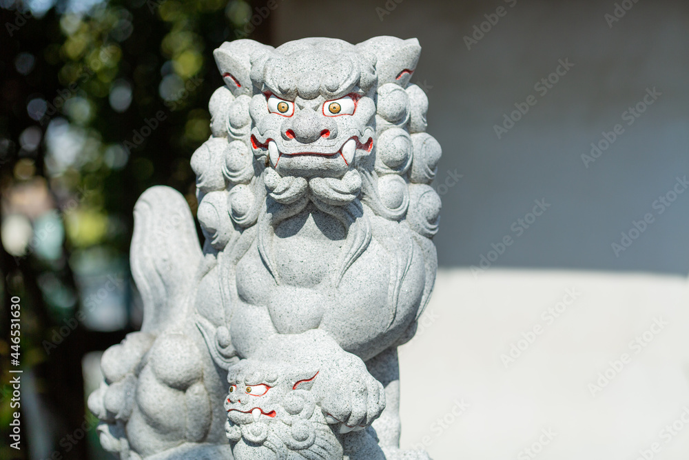 statue of guardian lion-dogs at suzuka shinto shrine in kagnagawa ...